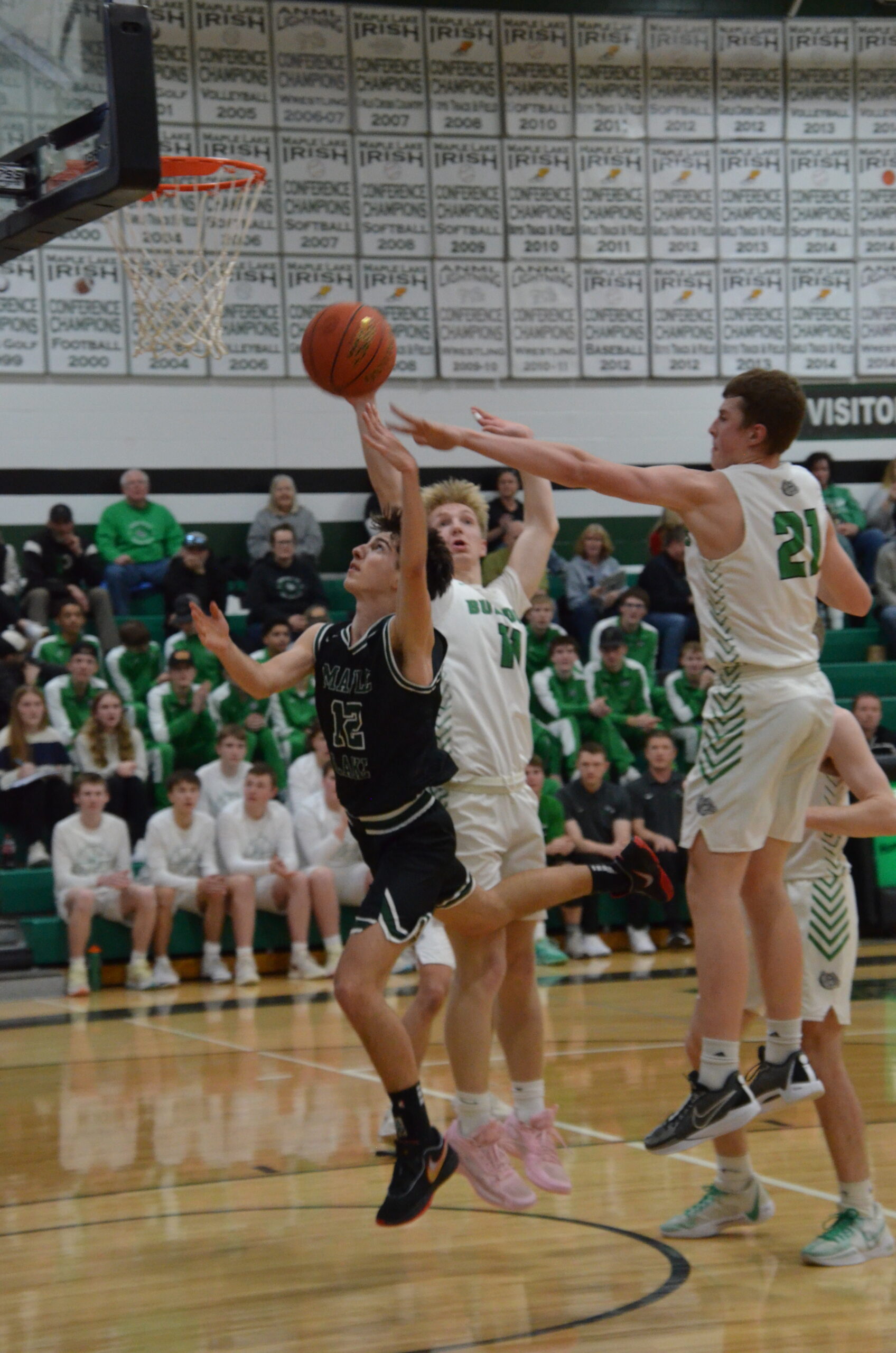 Irish fall to contenders in boys basketball action | Maple Lake Messenger
